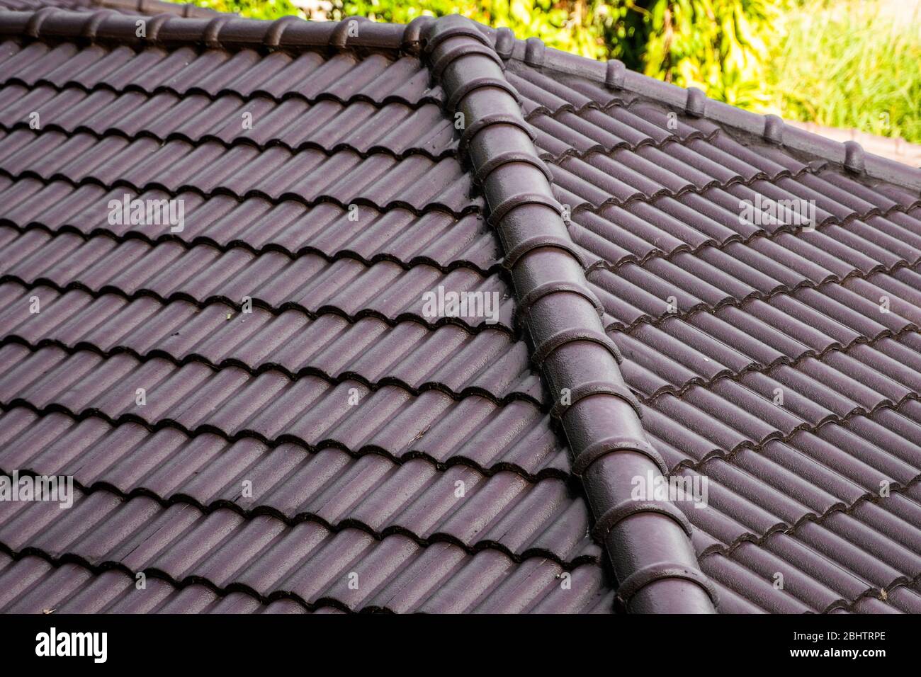 Brown natural tile roof. Modern types of roofing materials. Roof of the ...
