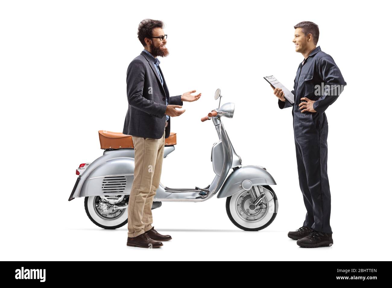 Full length shot of a motorcycle mechanic talking to a bearded man with ...