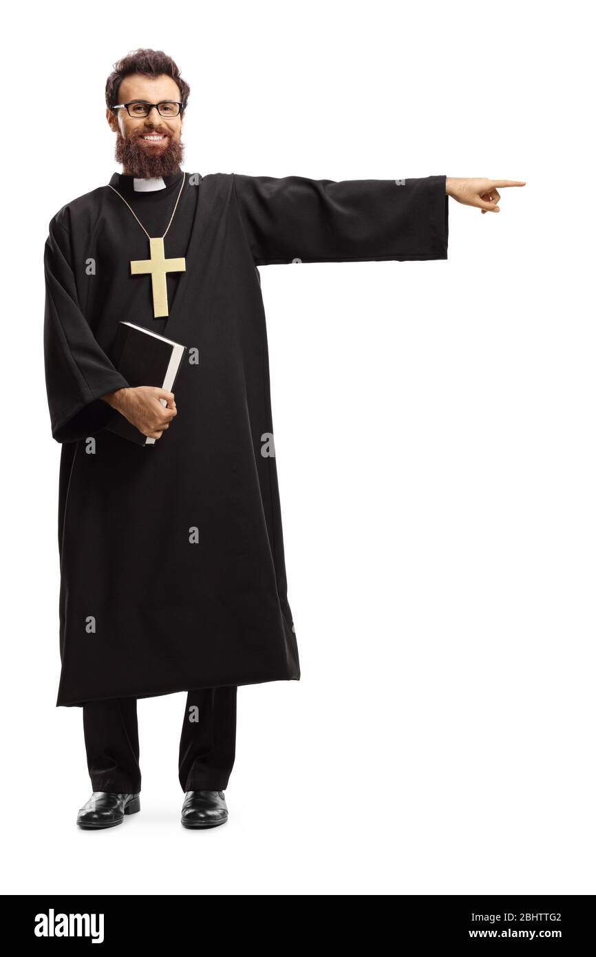 Full length portrait of a priest leaning on a wall and pointing ...