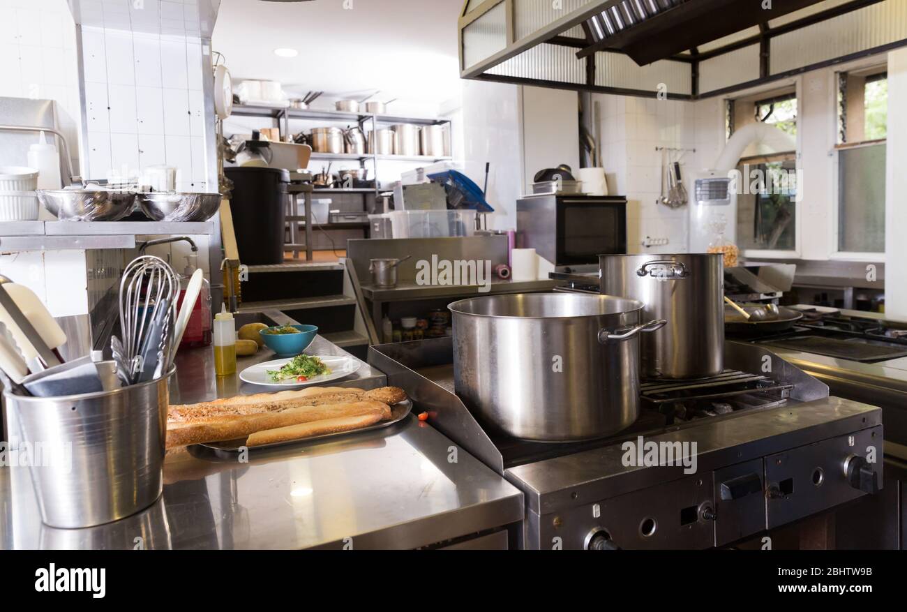 View of empty restaurant kitchen with professional equipment and ...