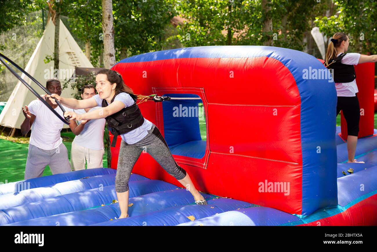 Attraction who is stronger and faster will put a hoop on a stick Stock ...