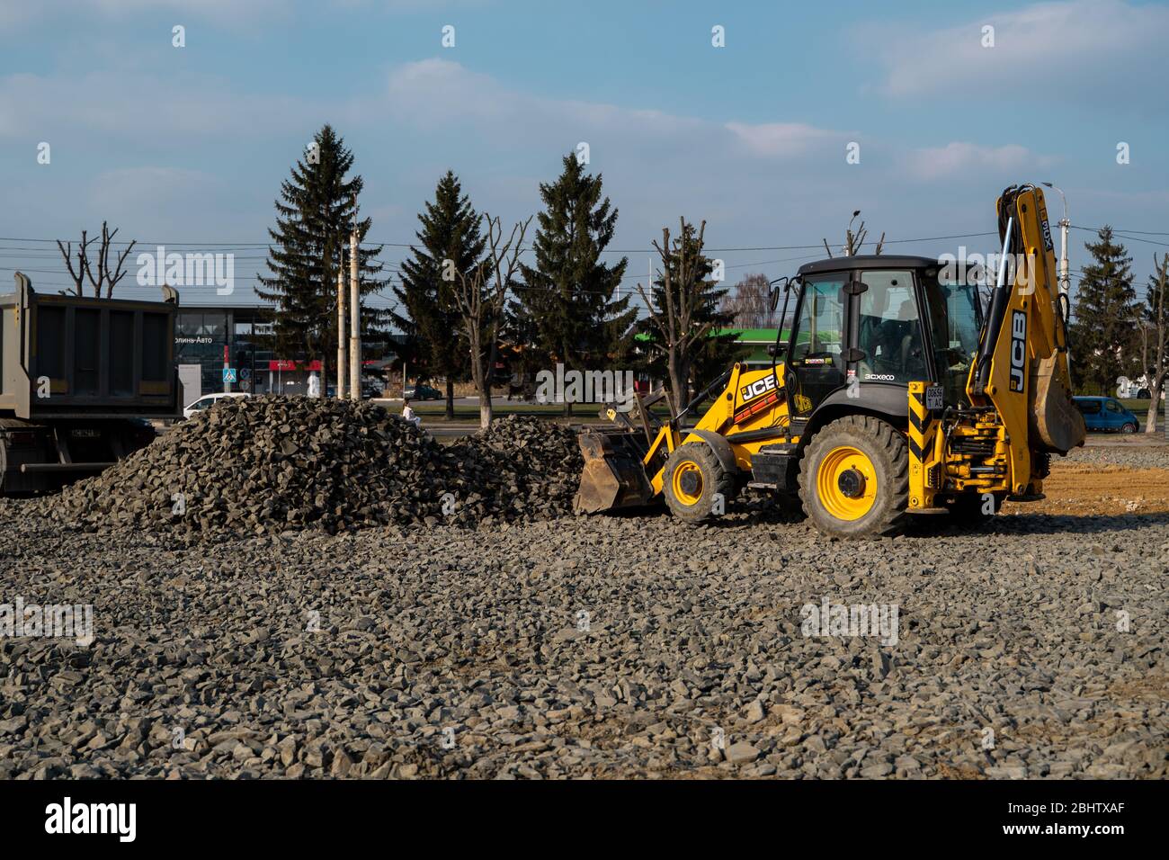 UKRAINE, LUTSK - April 10, 2020: Yellow wheel loader Excavator machine ...