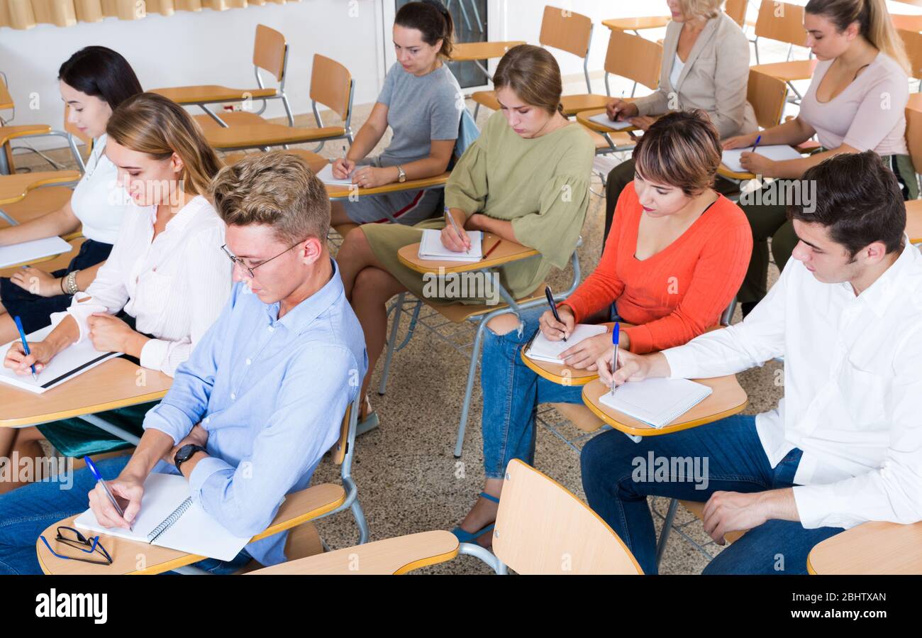 Portrait of group of different age people in lecture hall at extension ...