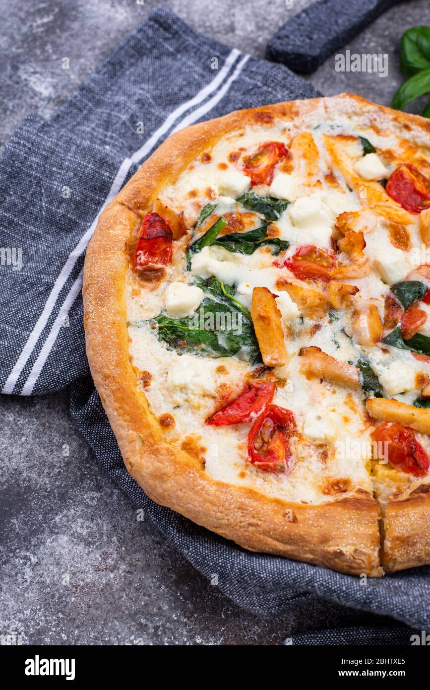 Italian pizza with tomato, mozzarella and chicken Stock Photo - Alamy