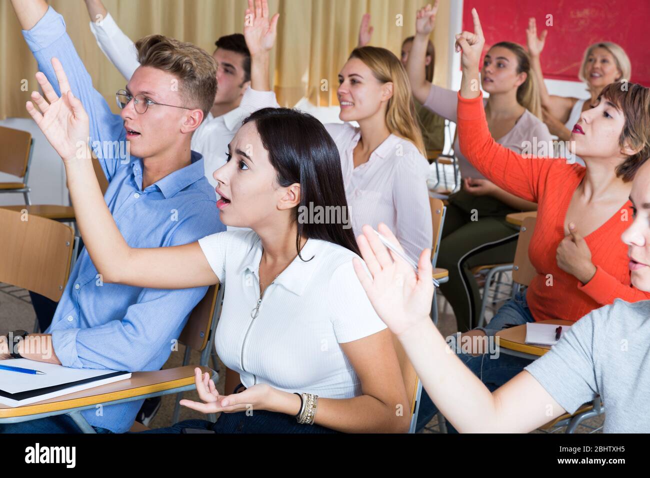 Students audience raising hands hi-res stock photography and images - Alamy