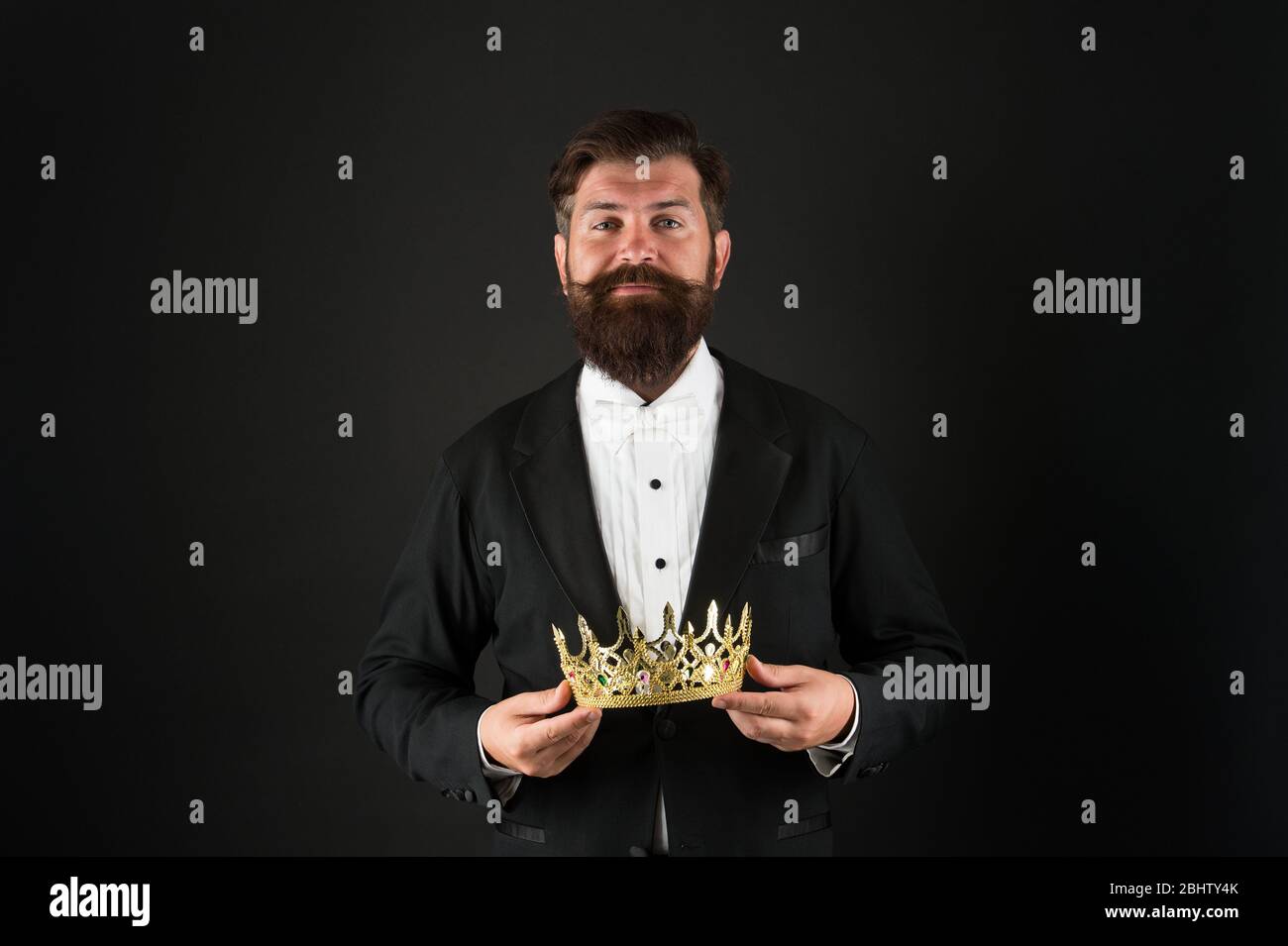 Now come and make it worth. Crown in hands. Handsome man give crown ...