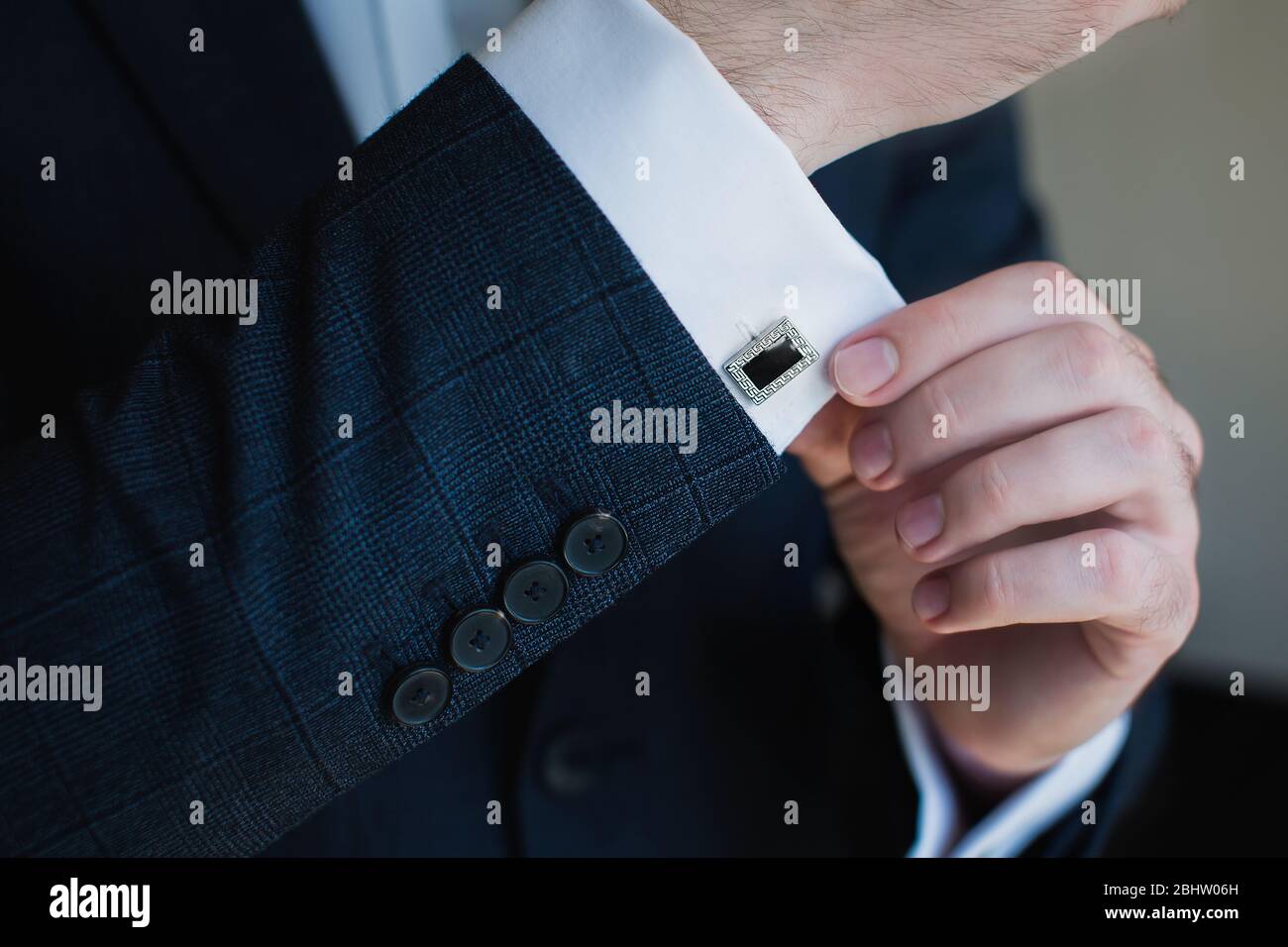 Man fixing shirt cuff hi-res stock photography and images - Alamy
