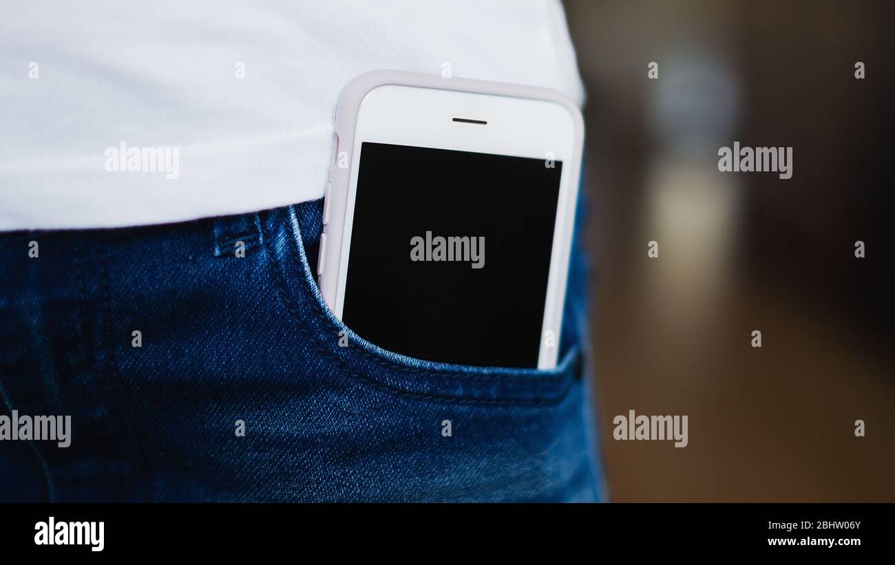 phone with screen in jeans pocket Stock Photo - Alamy
