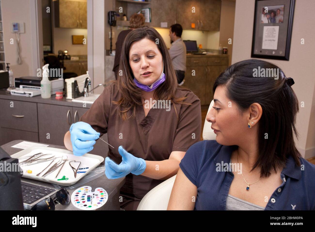 Dental procedure shows professional assistant hi-res stock photography ...