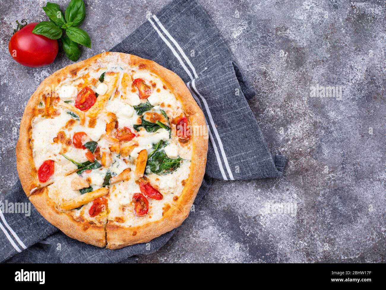 Italian pizza with tomato, mozzarella and chicken Stock Photo - Alamy