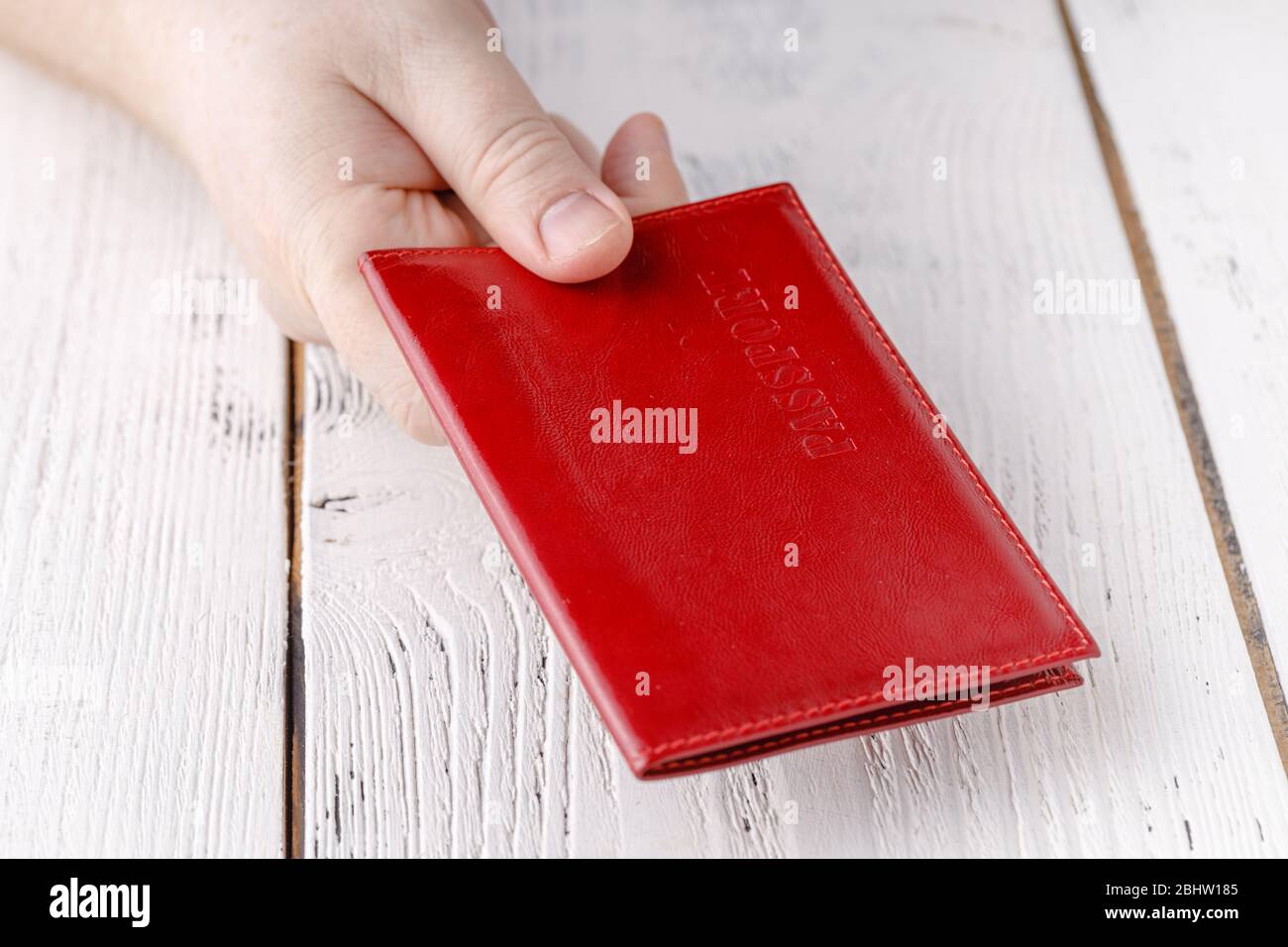 man hand holding passport id Stock Photo - Alamy