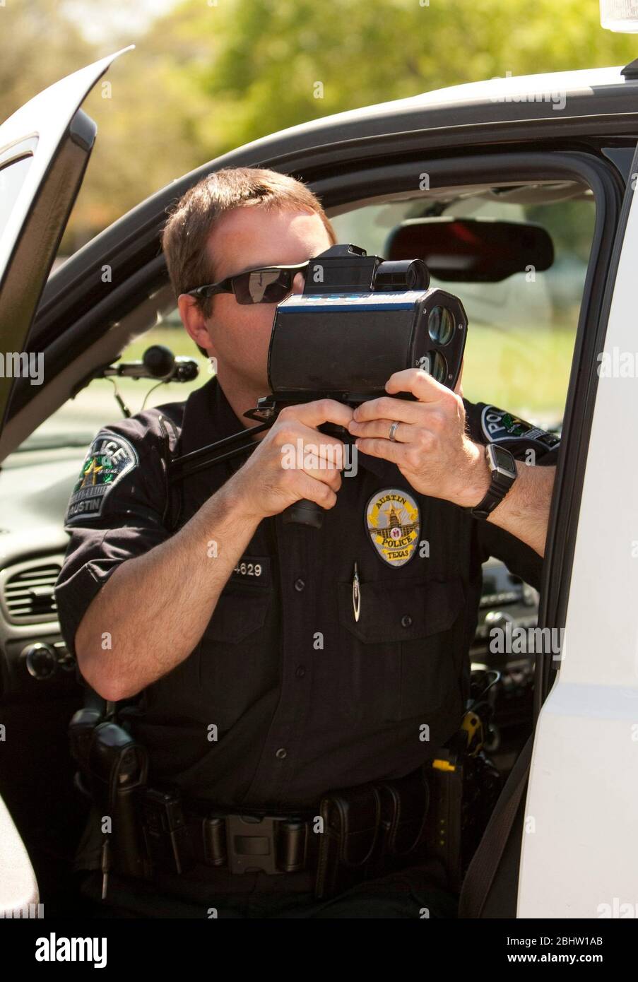 Austin Texas USA, April 6, 2011: Police officer uses radar gun to ...