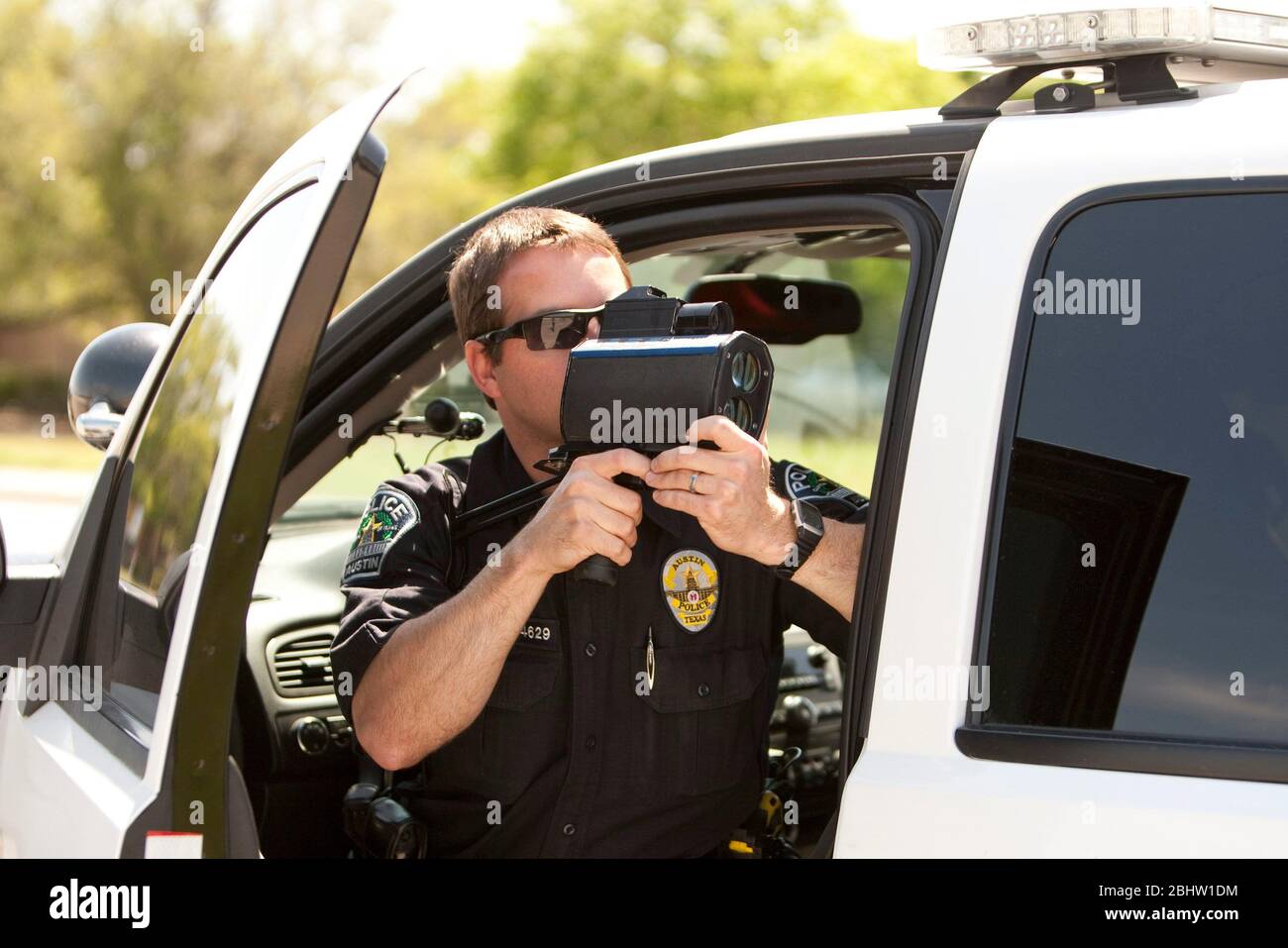 Austin Texas USA, April 6, 2011: Police officer uses radar gun to ...
