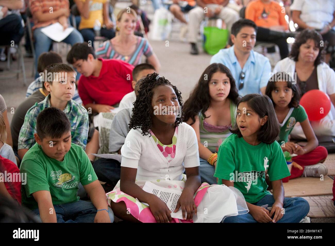 Diverse children listen to story hi-res stock photography and images ...
