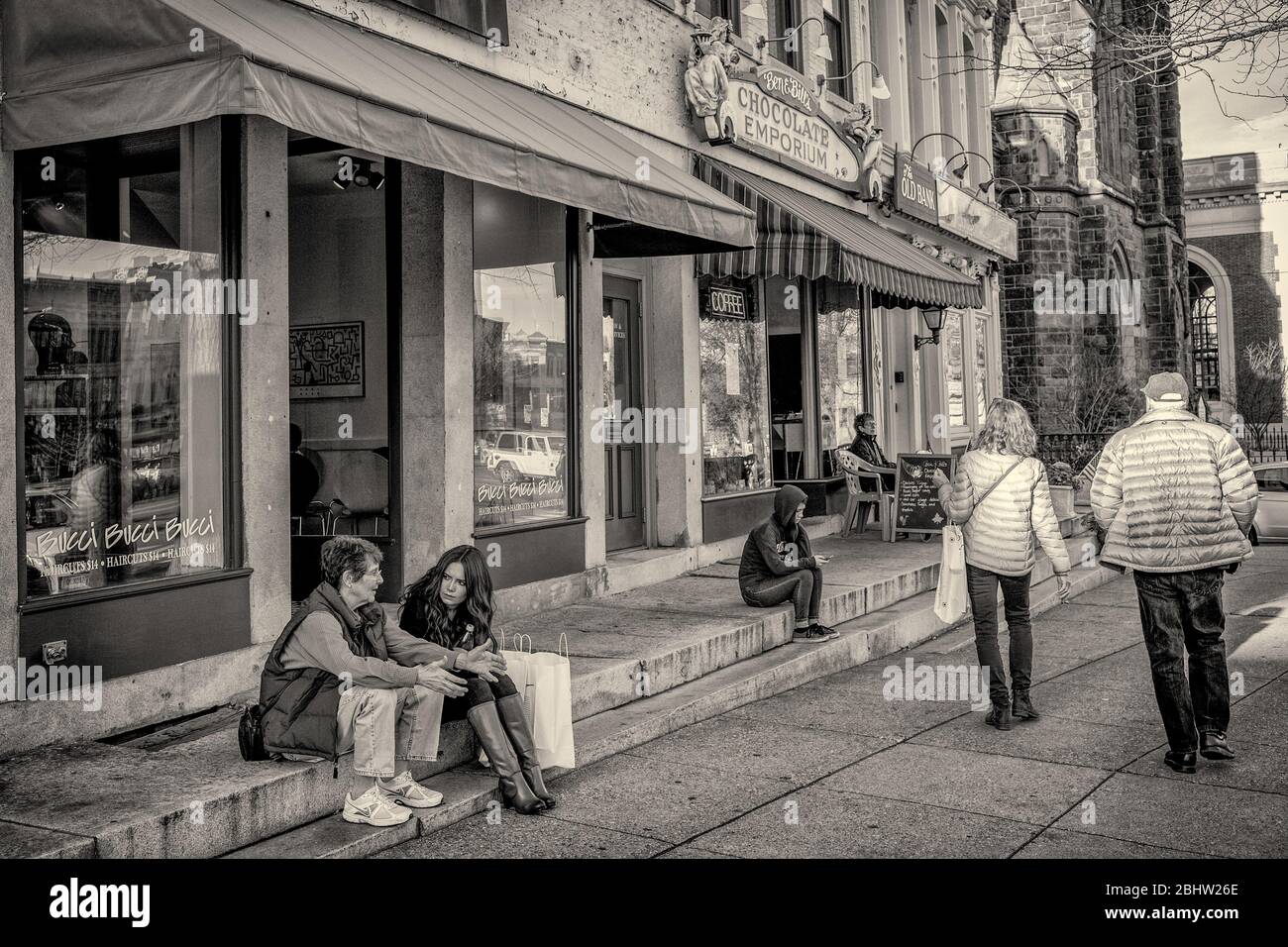 People sitting, walking on the sidewalk in downtown Northampton, MA ...
