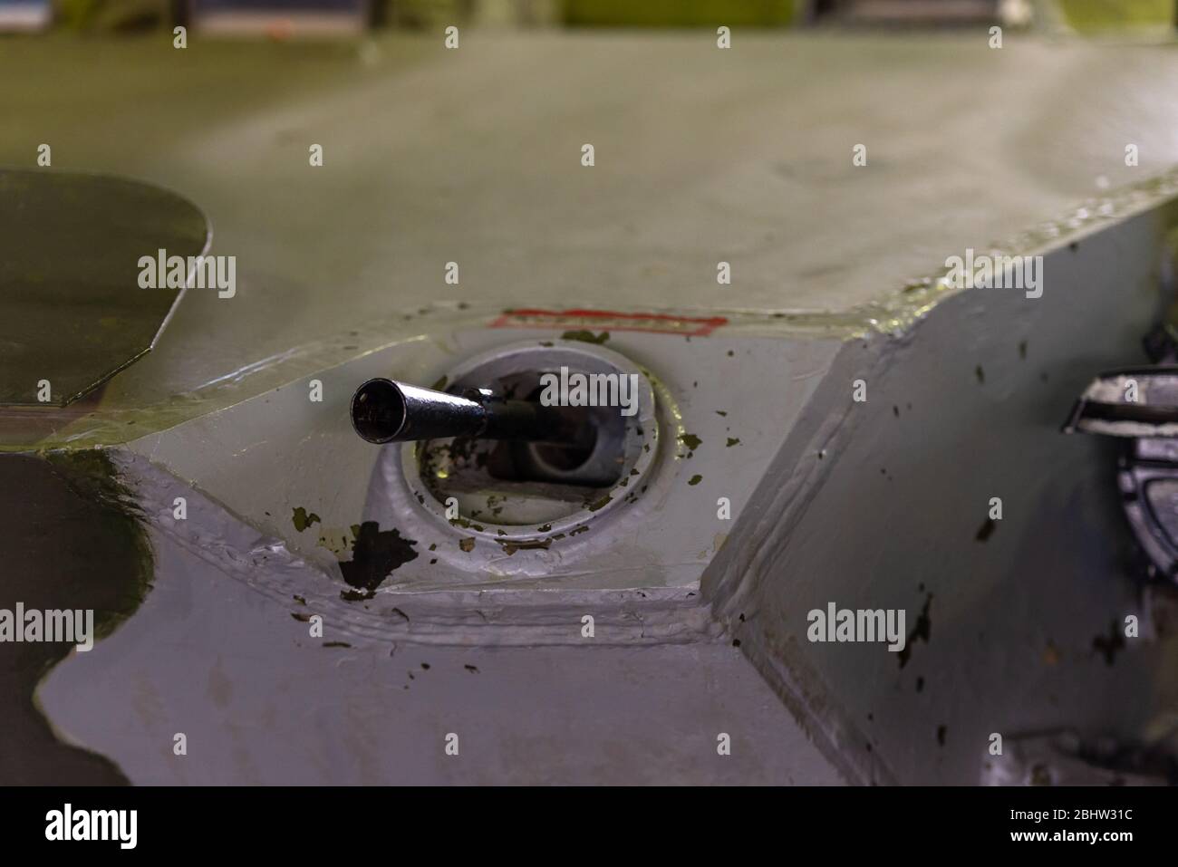 Military equipment of the second world war. A machine gun looks out of ...