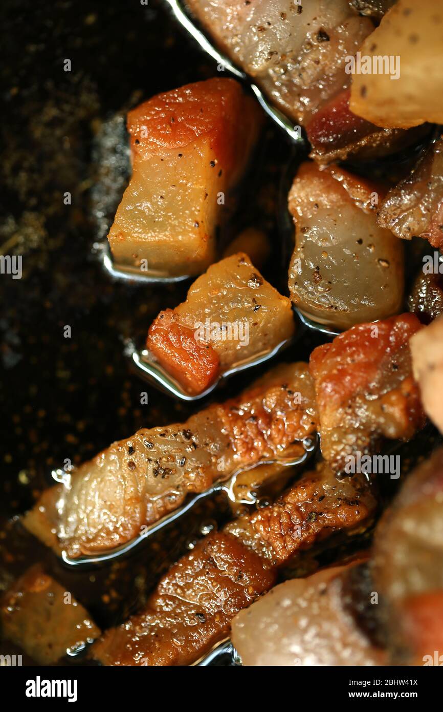 Guanciale pig's cheek cooking in Rome Italy Stock Photo - Alamy