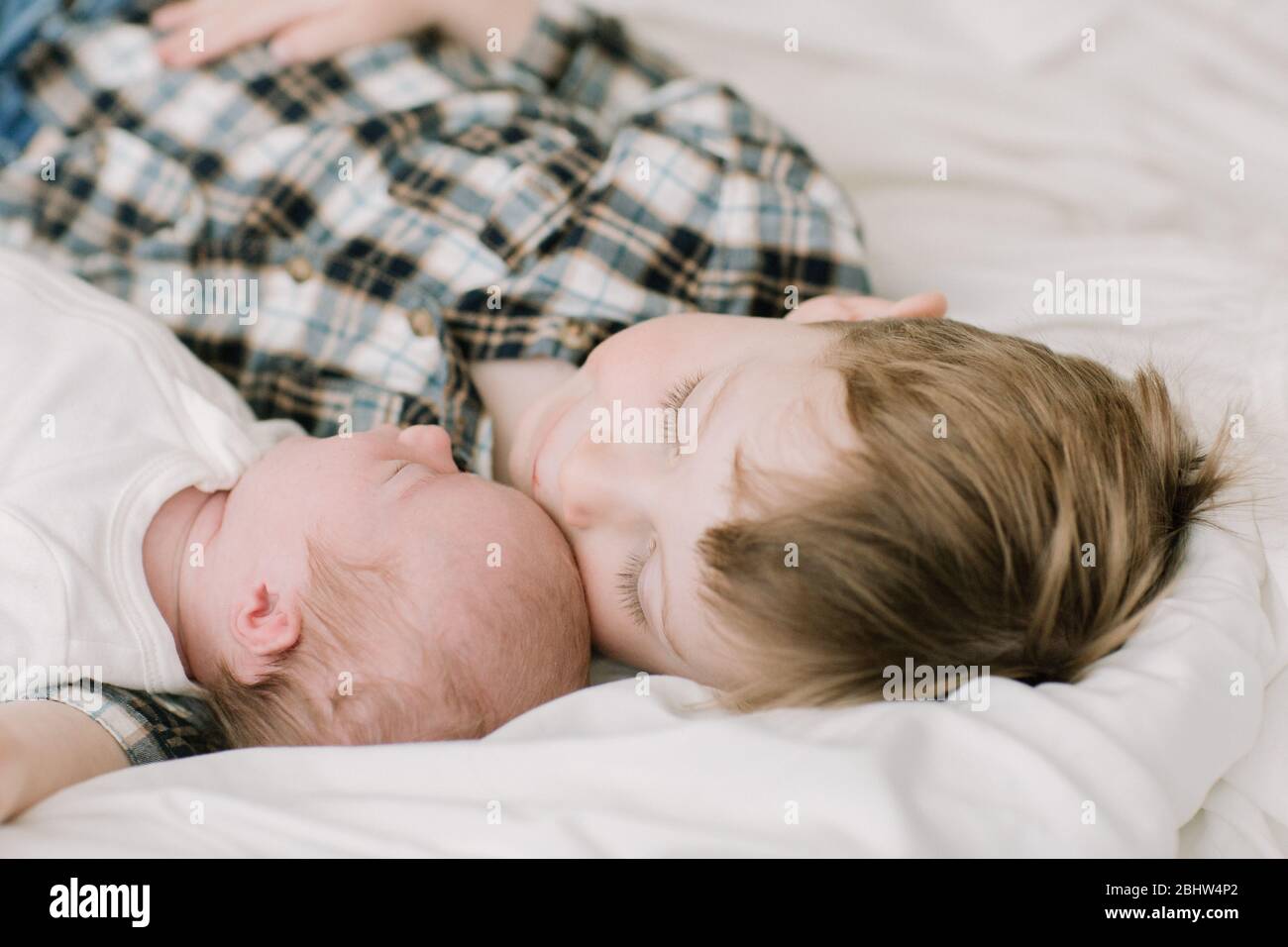 Brother and sister snuggling hi-res stock photography and images - Alamy