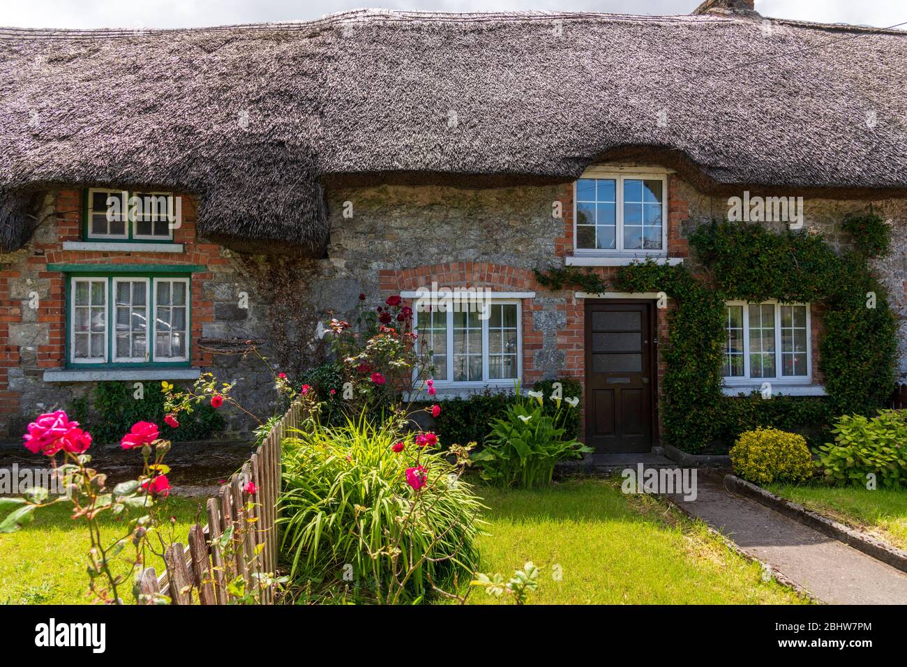 Small old white house with straw roof Stock Photo - Alamy