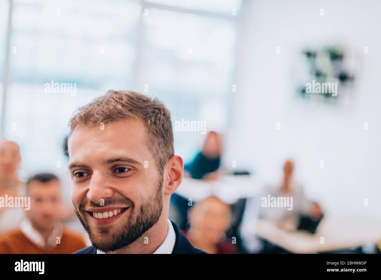 Close up shot of a male business coach speaker in suit consulting new ...