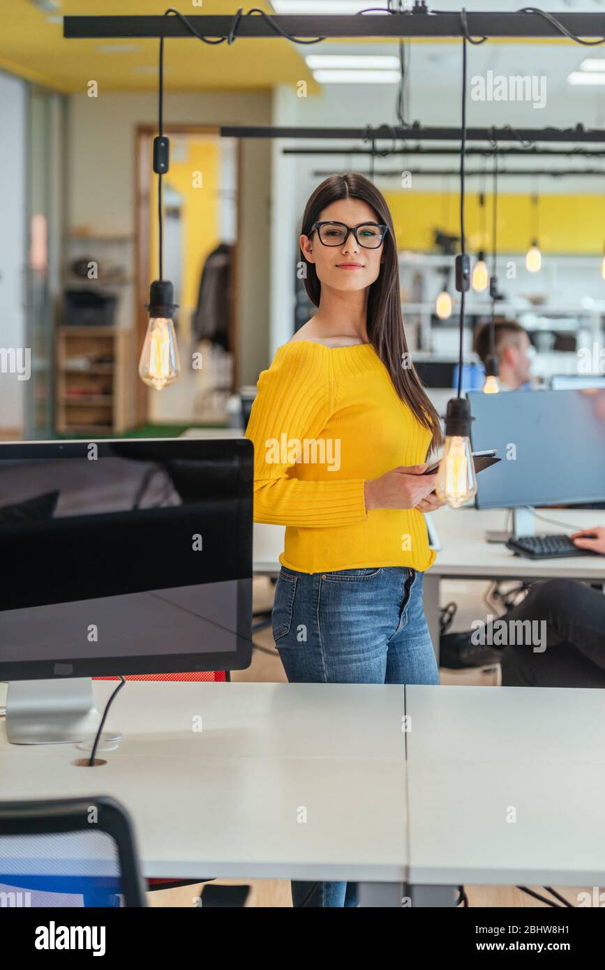 Female boss, manager executive posing in a modern startup office while ...