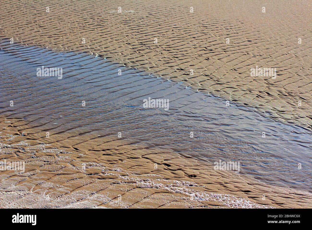 sandy surface of low tide Stock Photo - Alamy