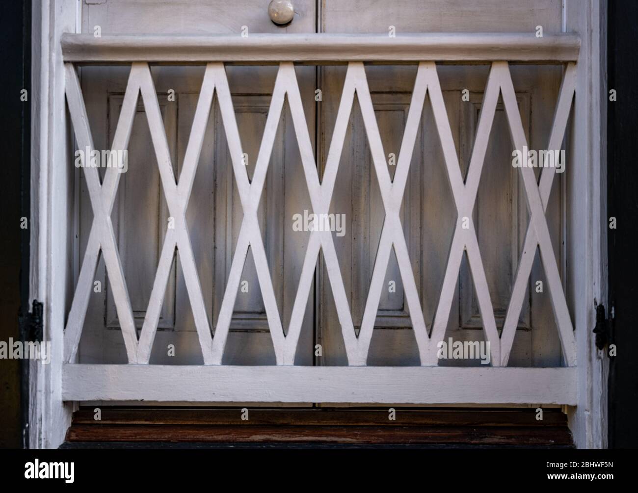 Wooden Railing made of Diamond shapes in front of door Stock Photo - Alamy