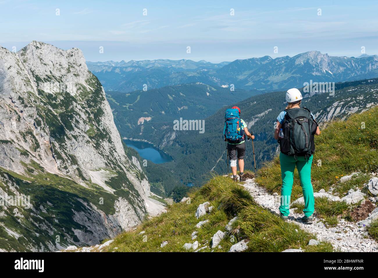 Hiker on hiking trail from Simonyhuette to Adamekhuette, steep alpine ...