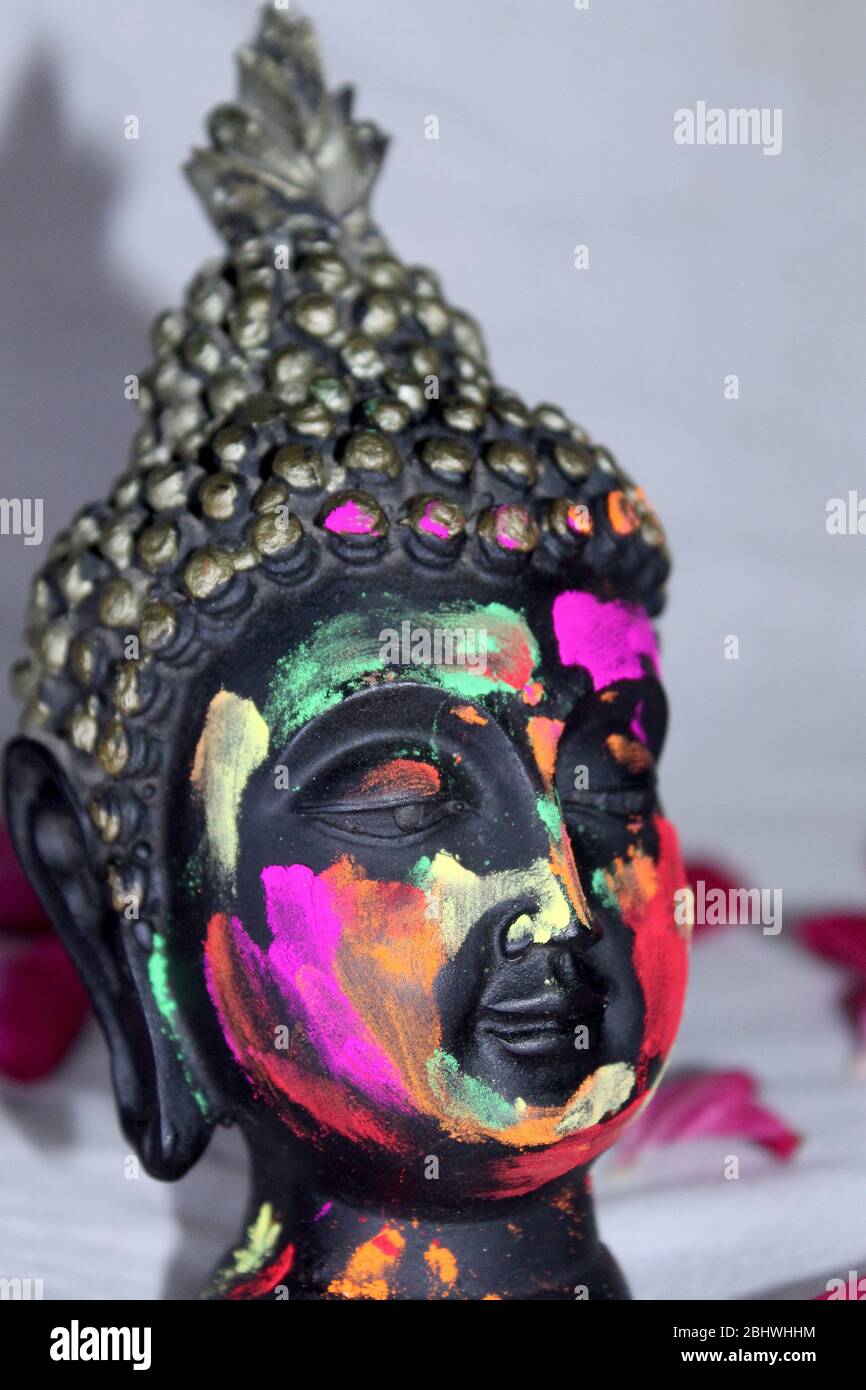 colorful face of lord Buddha statue in festival, traditional colors on ...