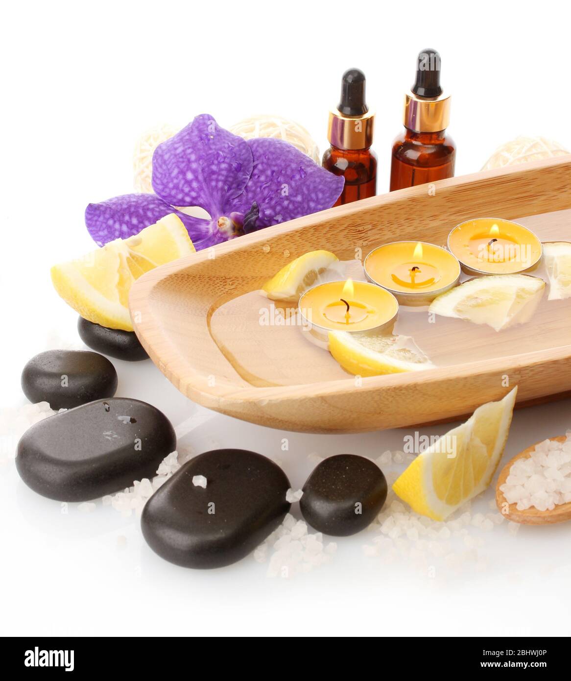 Beautiful spa setting with flower and orange, isolated on white Stock ...