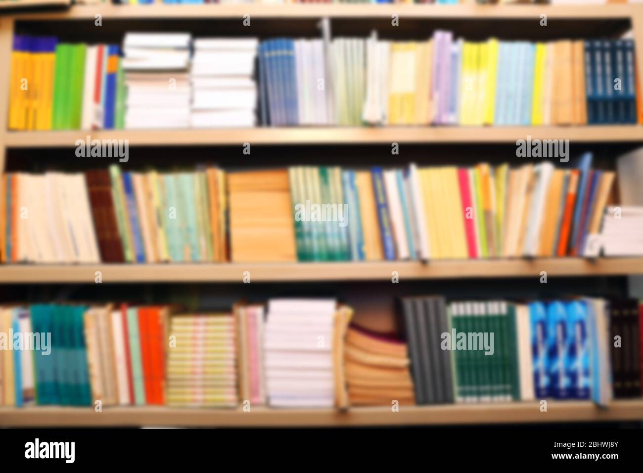 Many books on bookshelf in library Stock Photo - Alamy