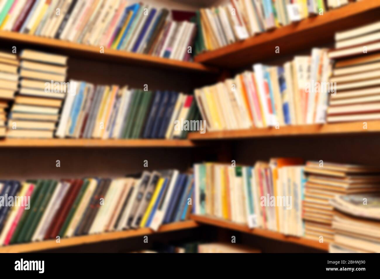 Many books on bookshelf in library Stock Photo - Alamy