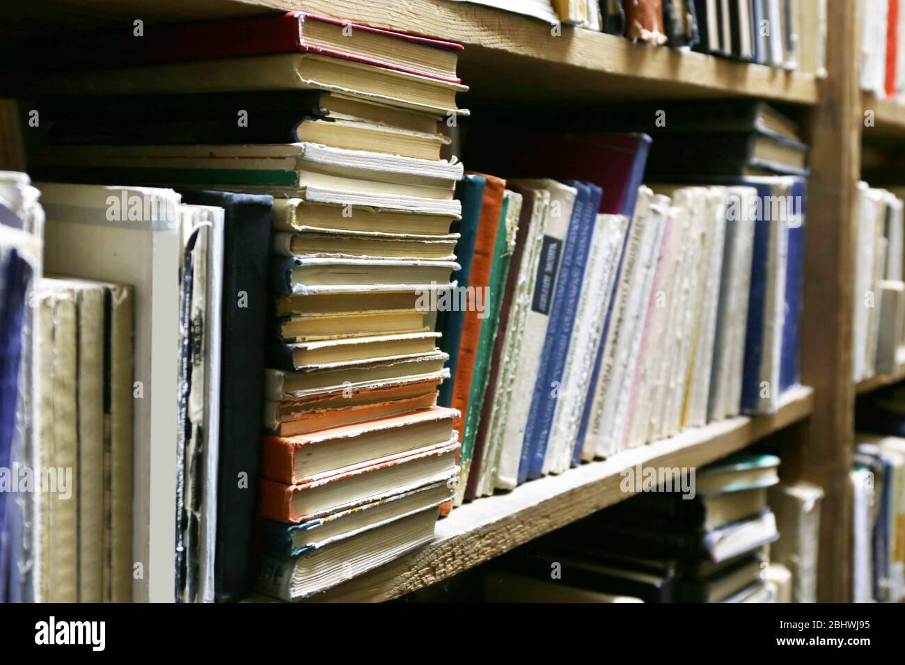 Many books on bookshelf in library Stock Photo - Alamy
