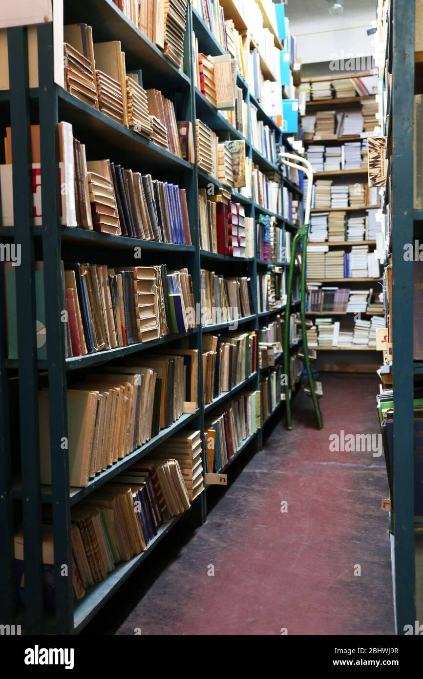 Many books on bookshelf in library Stock Photo - Alamy