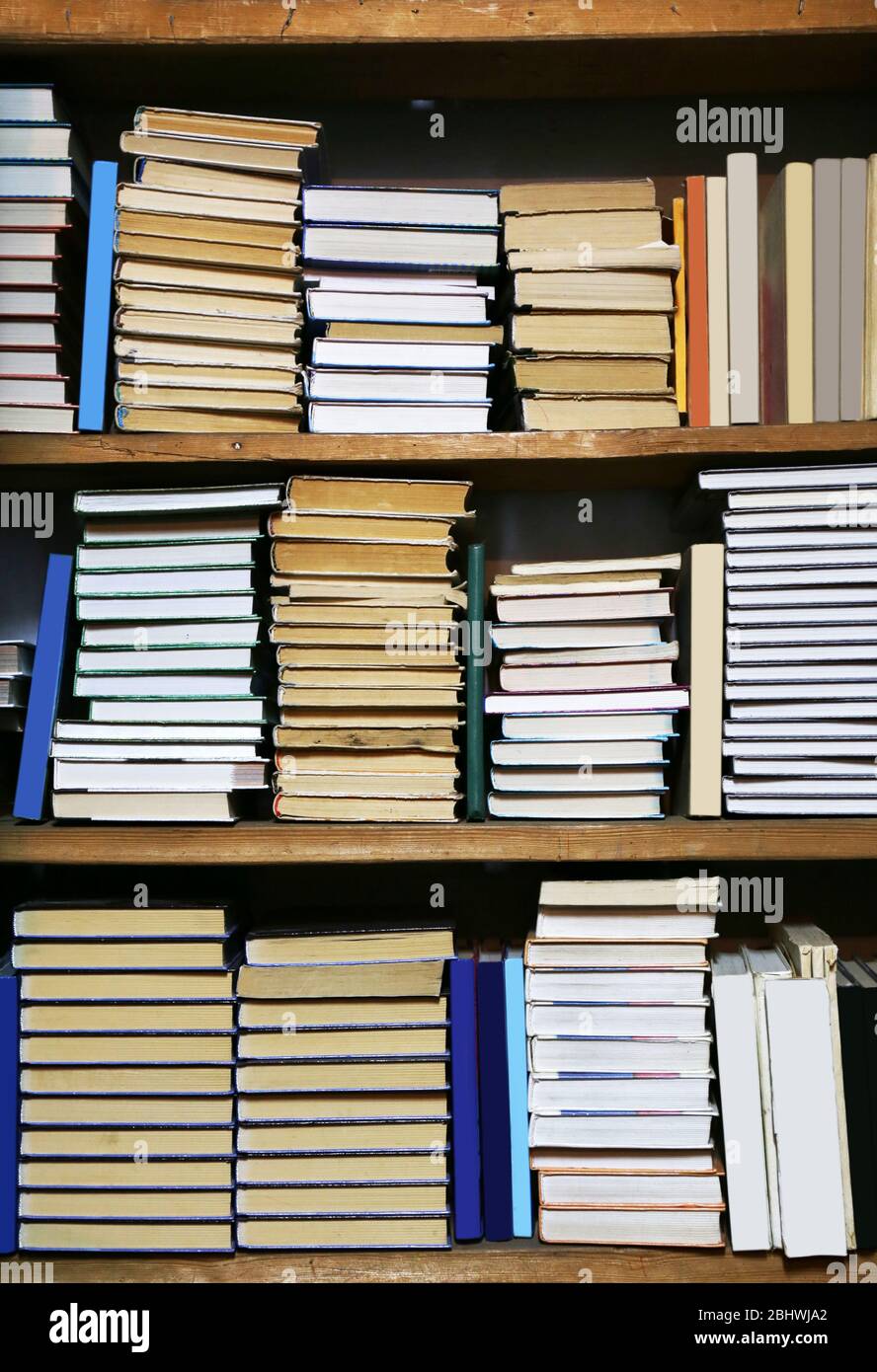 Many books on bookshelf in library Stock Photo - Alamy