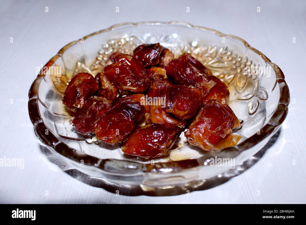 delicious dried date palm fruits cut pieces in glass bowl Stock Photo ...