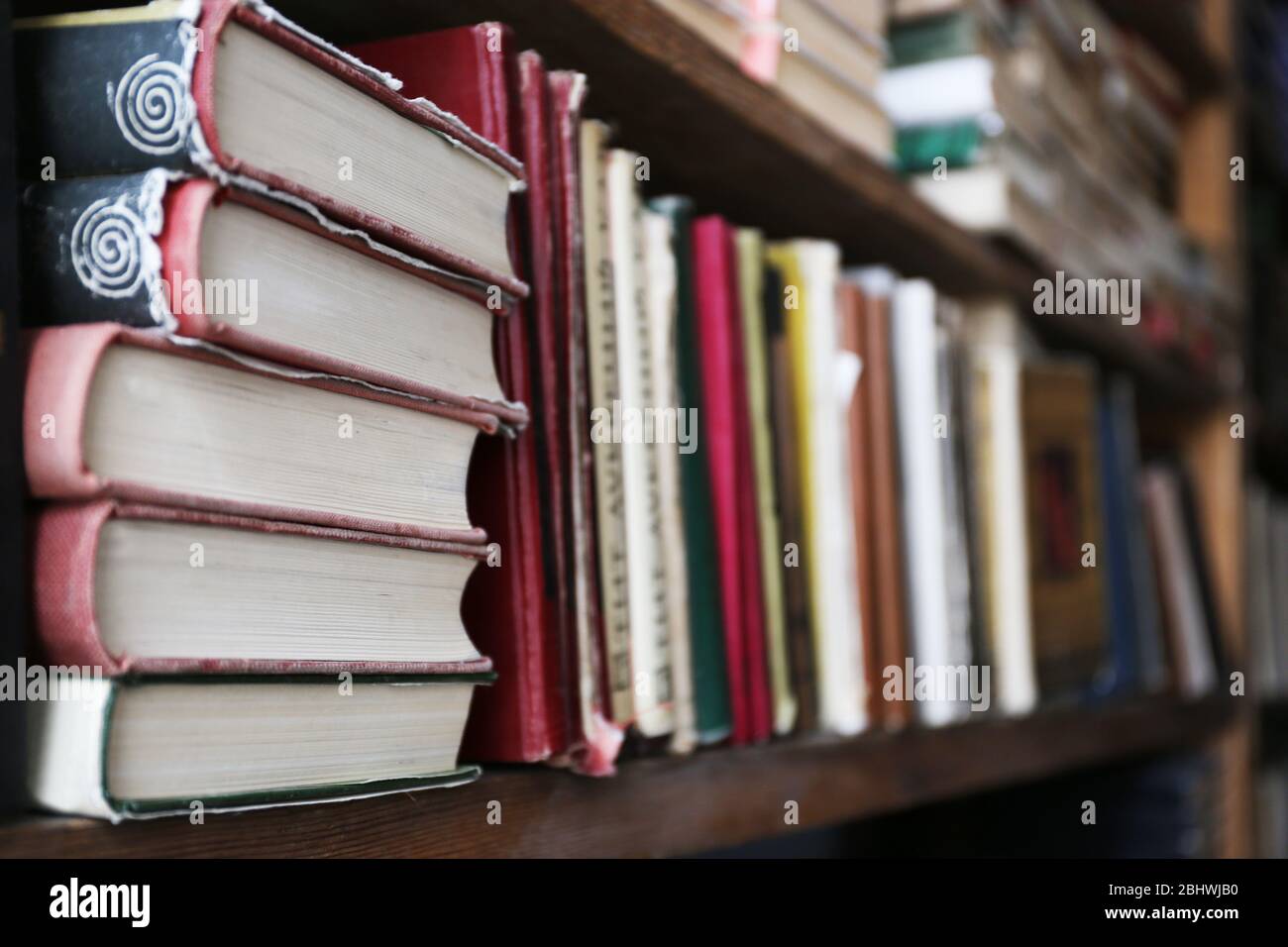 Many books on bookshelf in library Stock Photo - Alamy