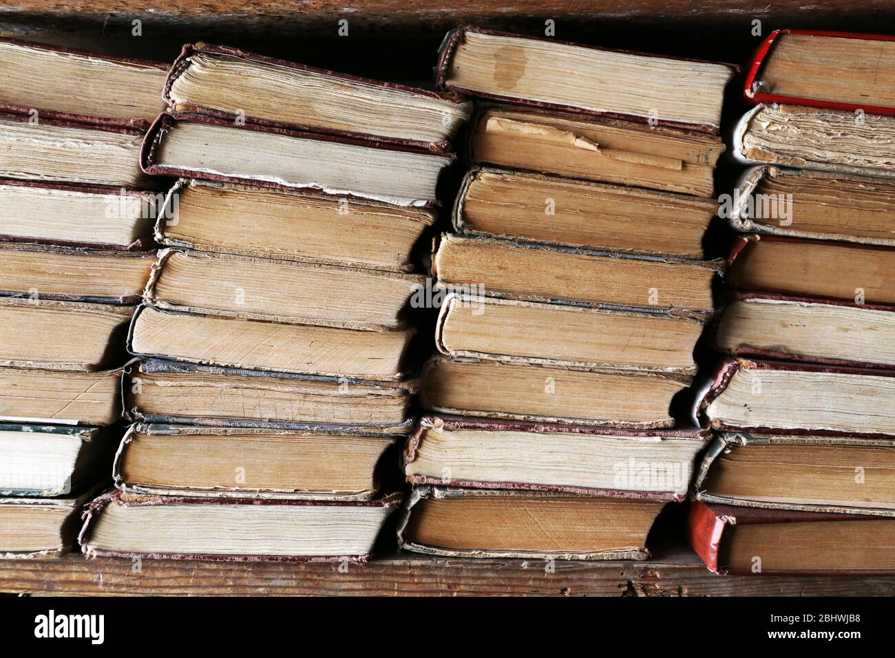 Many books on bookshelf in library Stock Photo - Alamy