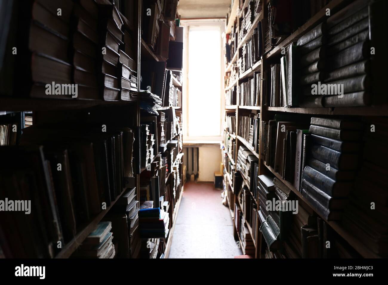 Many books on bookshelf in library Stock Photo - Alamy