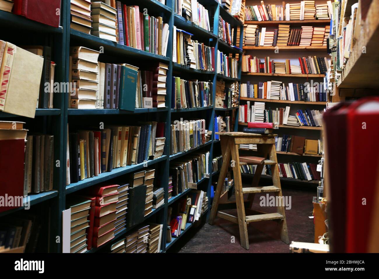 Many books on bookshelf in library Stock Photo - Alamy