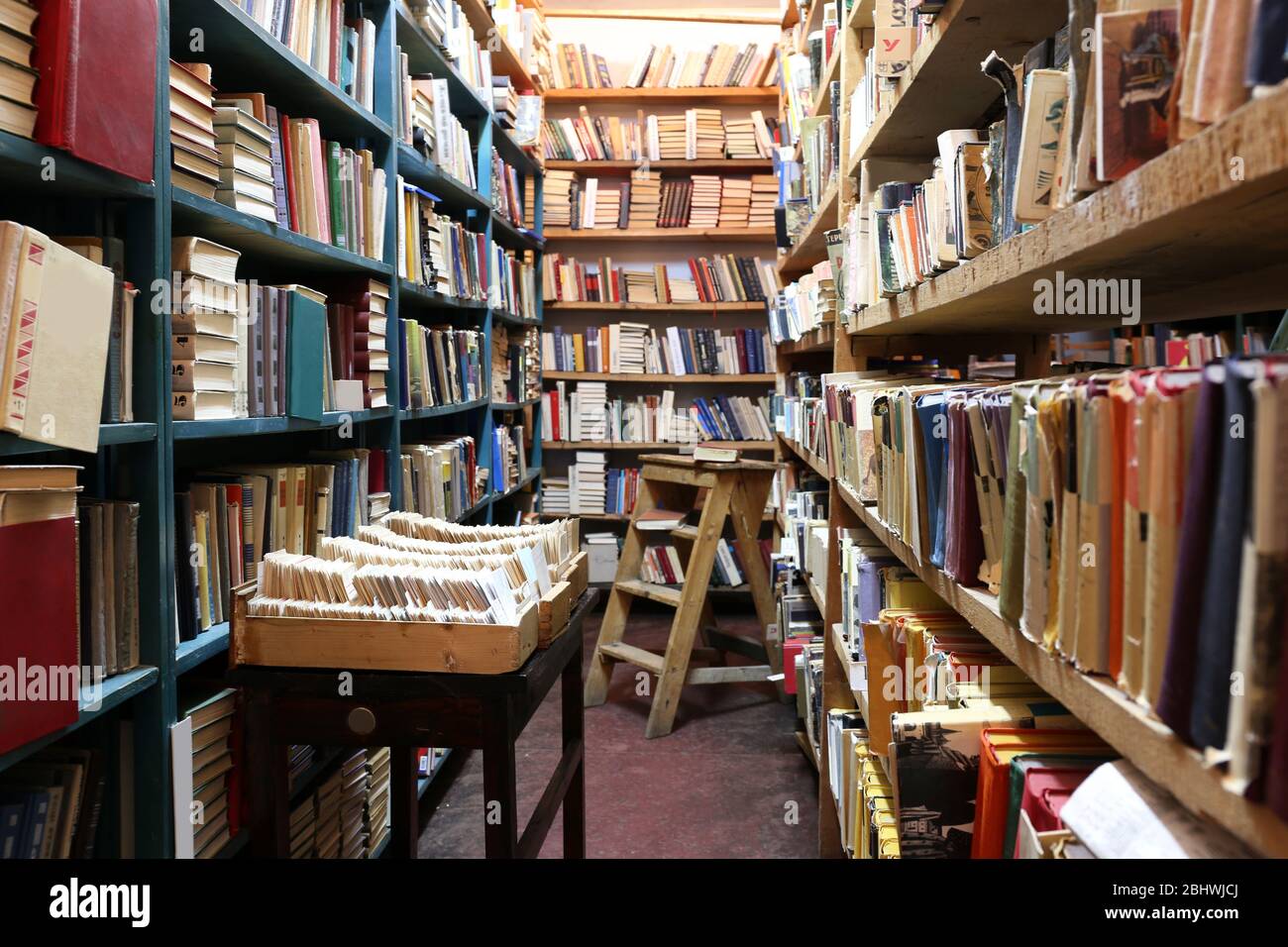 Many books on bookshelf in library Stock Photo - Alamy