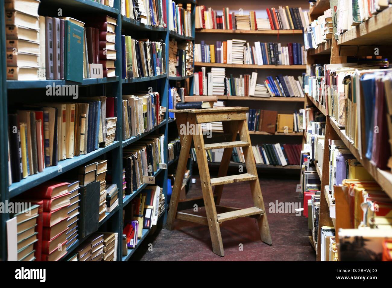 Many books on bookshelf in library Stock Photo - Alamy