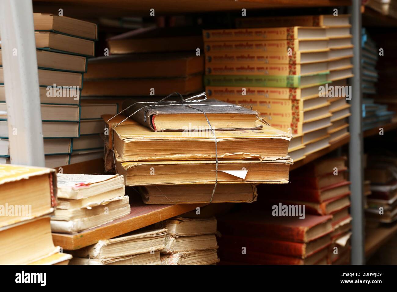 Many books on bookshelf in library Stock Photo - Alamy