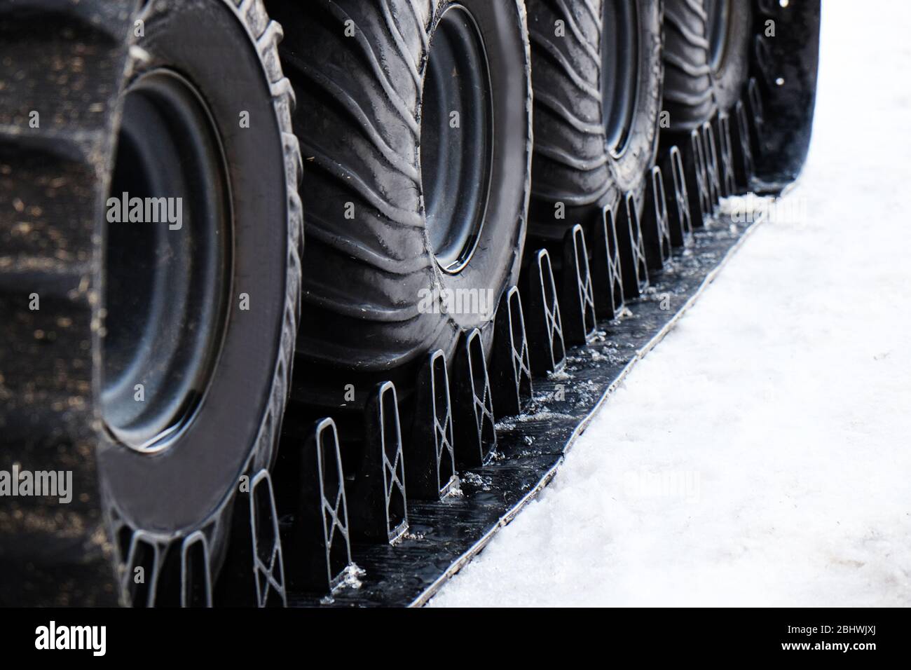Wheel of snowmobile on snow, closeup Stock Photo - Alamy