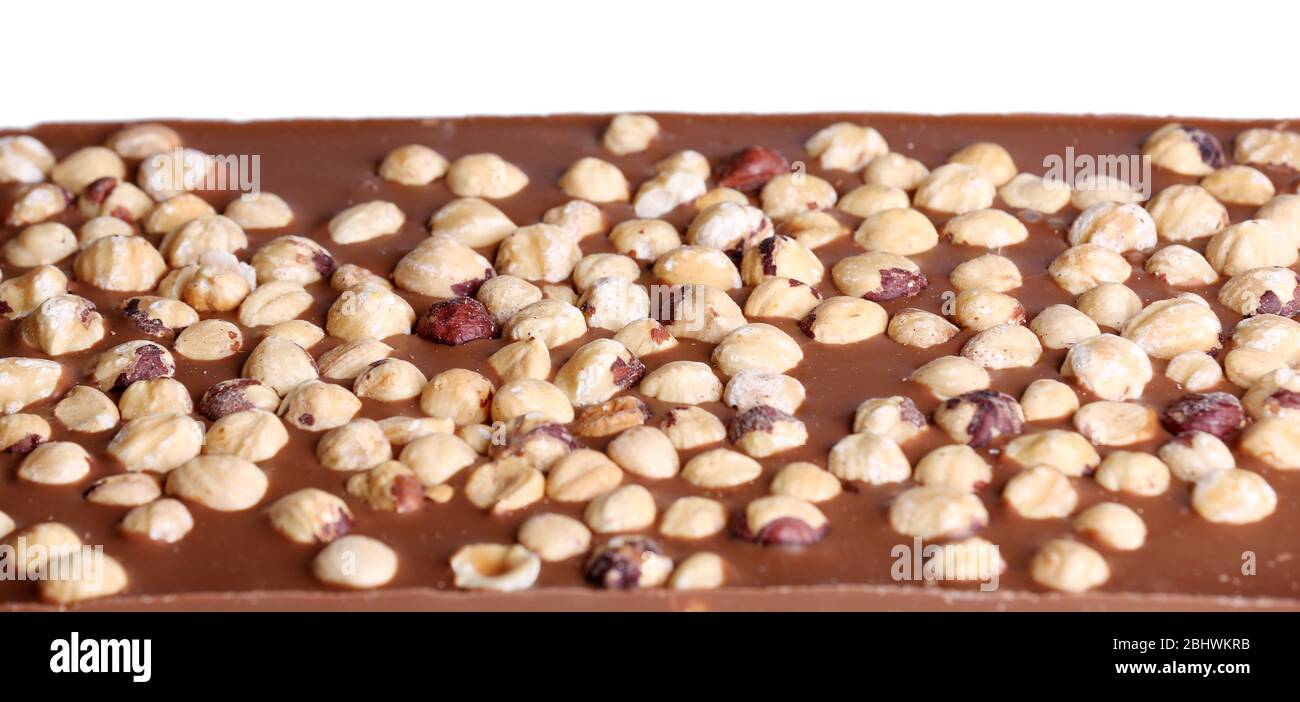Milk chocolate bar with hazelnuts close up Stock Photo - Alamy