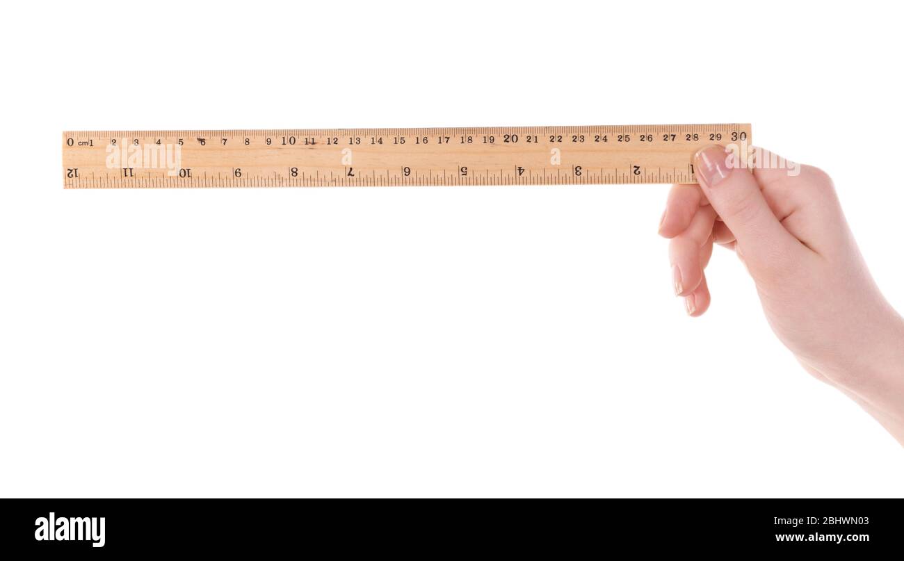 Female hand with wooden ruler isolated on white Stock Photo - Alamy