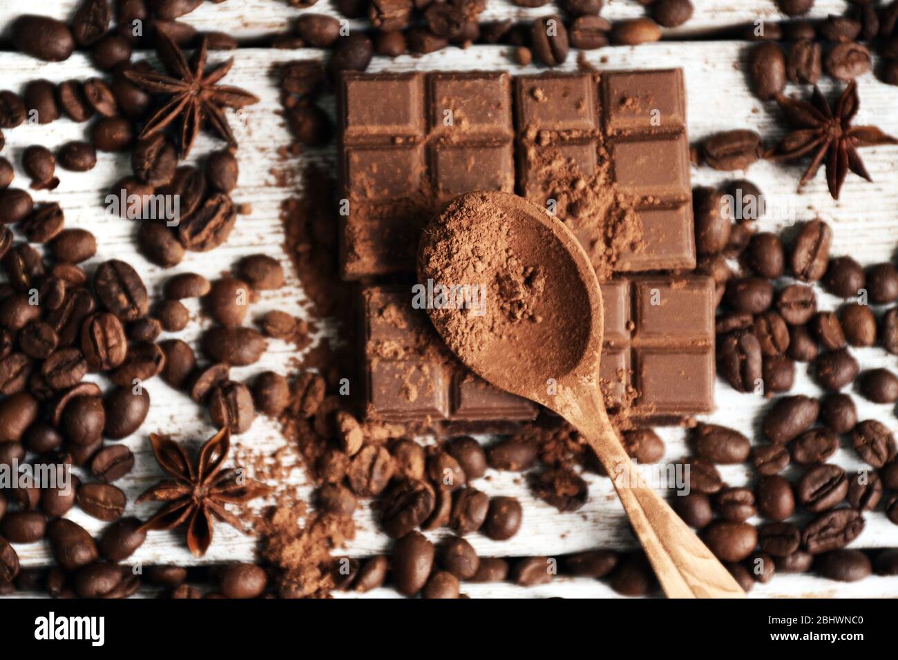 Still life with chocolate, grains and spice on wooden table, closeup ...