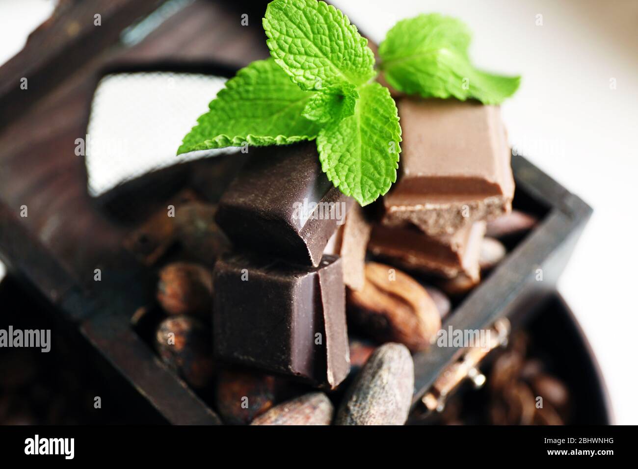 Still life with set of chocolate, nuts and coffee grains, closeup Stock ...
