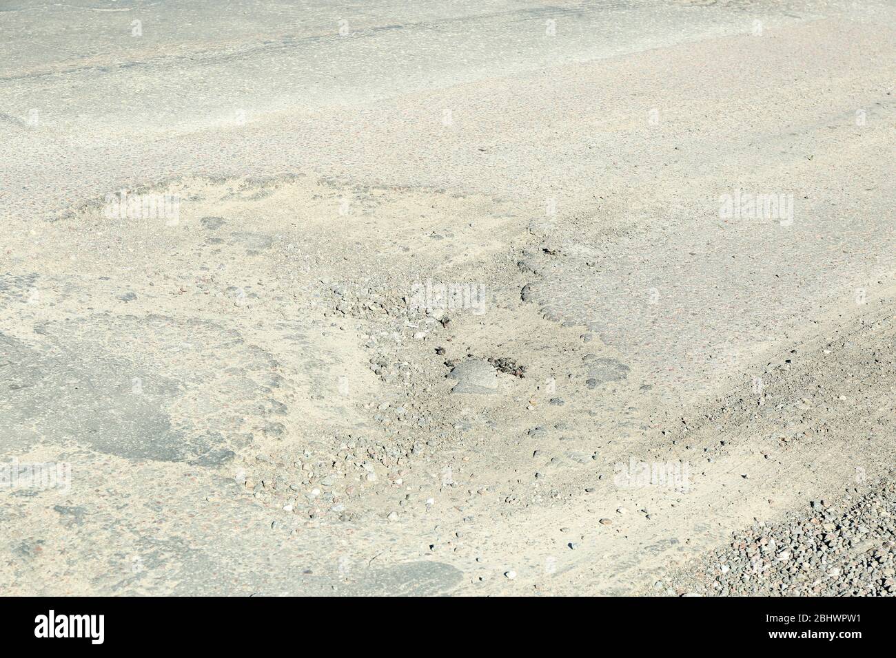 Very bad quality road with potholes Stock Photo - Alamy