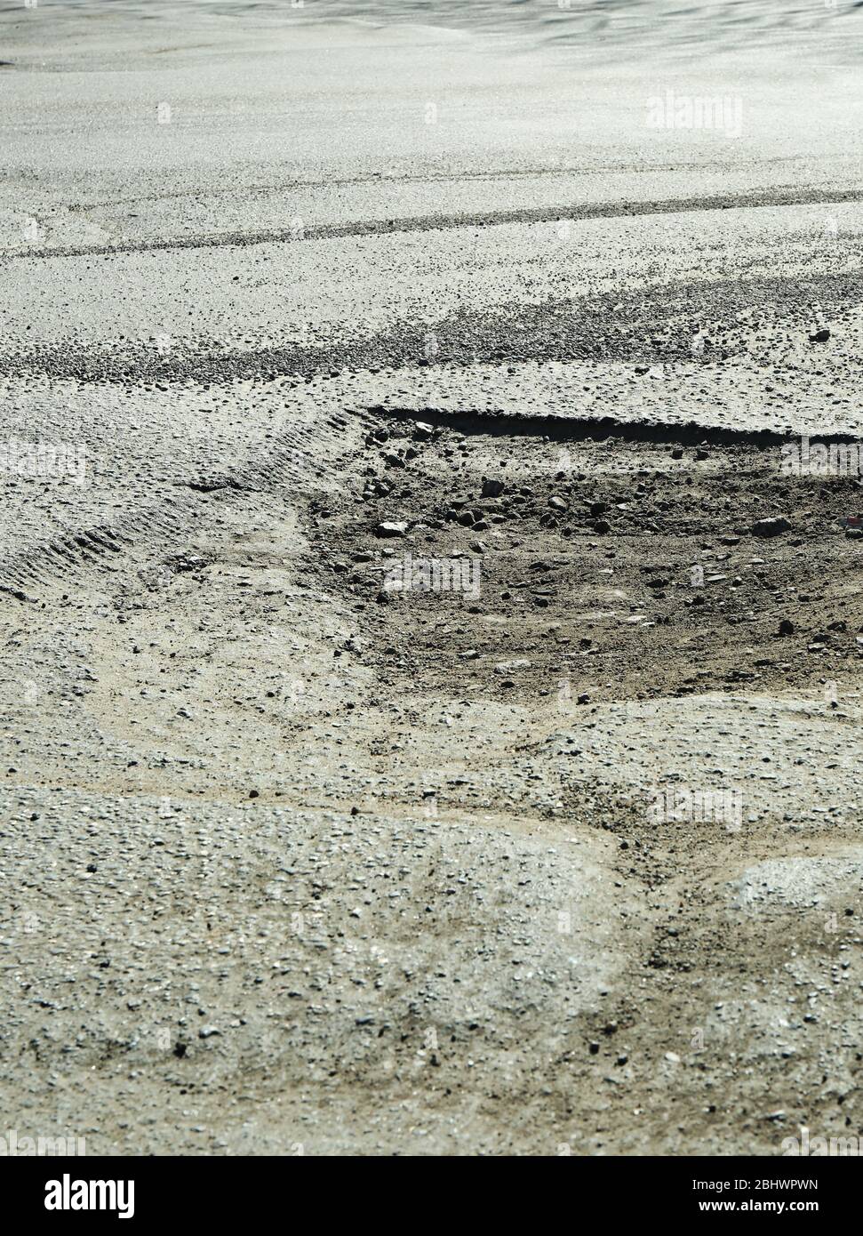 Very bad quality road with potholes Stock Photo - Alamy